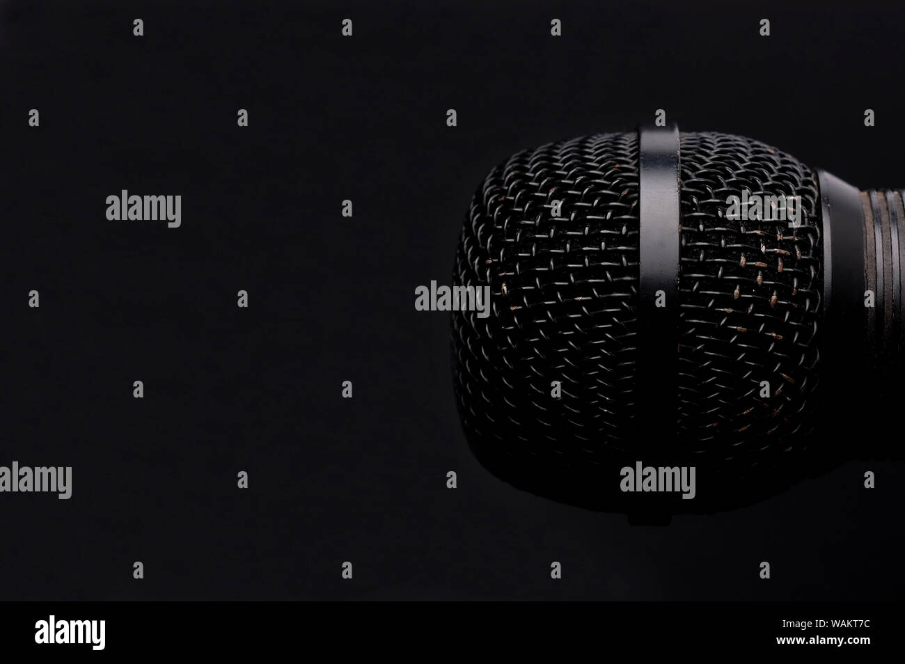 A microphone isolated on a black back ground Stock Photo - Alamy
