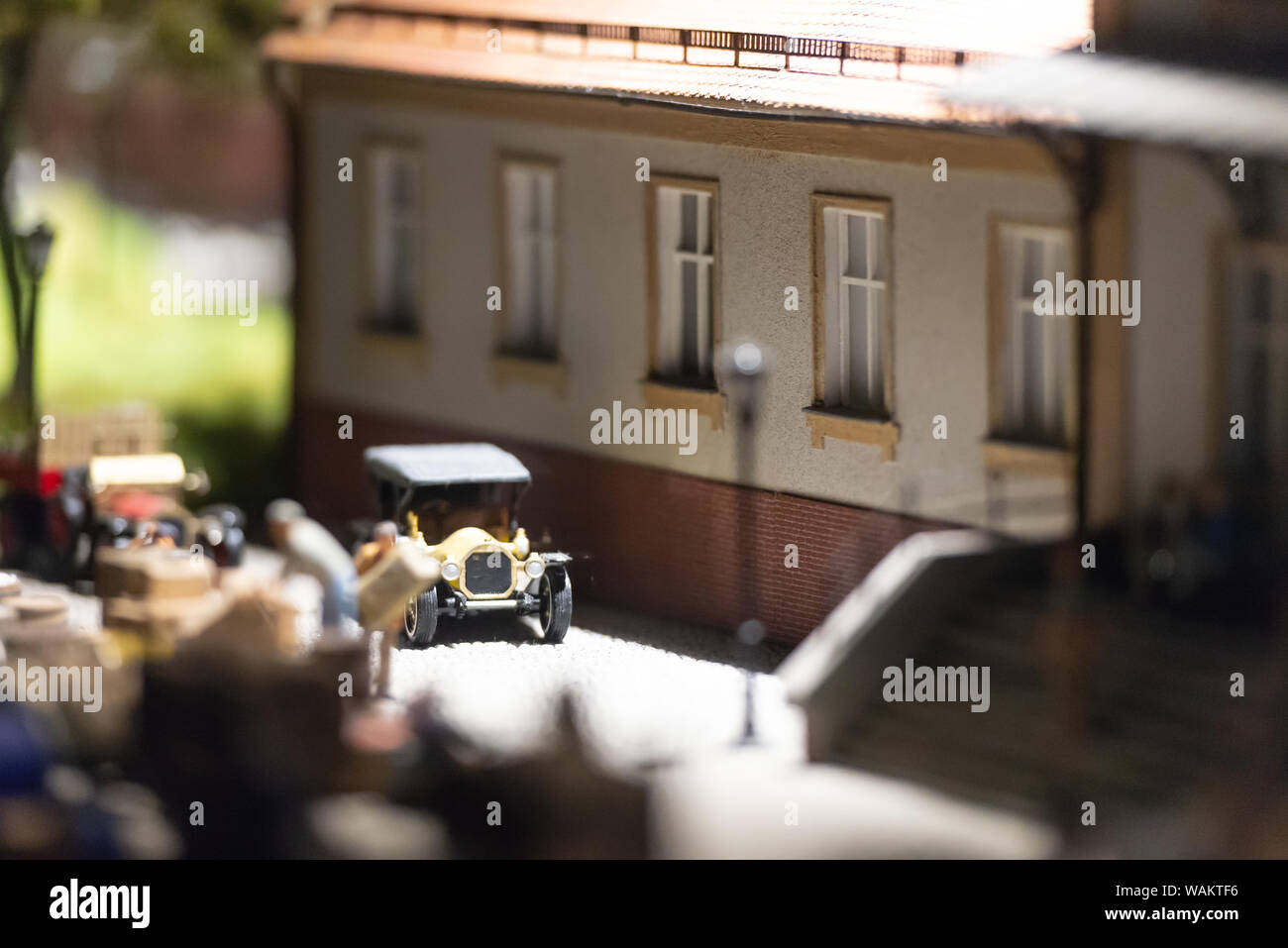 The layout of the city. Model retro car in front of the station Stock ...