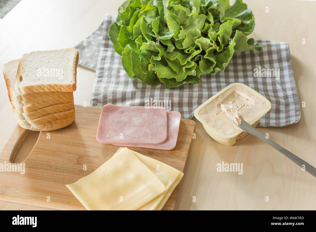 Composition for making sandwich with cheese and ham on a wooden table ...