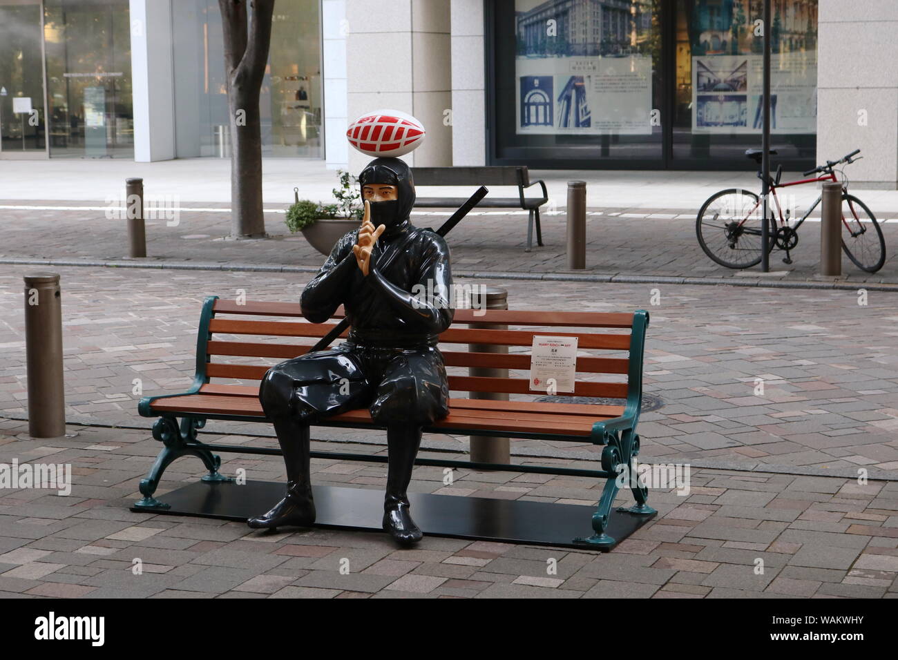 A ninja statue promoting the 2019 Rugby World Cup is on a bench in ...