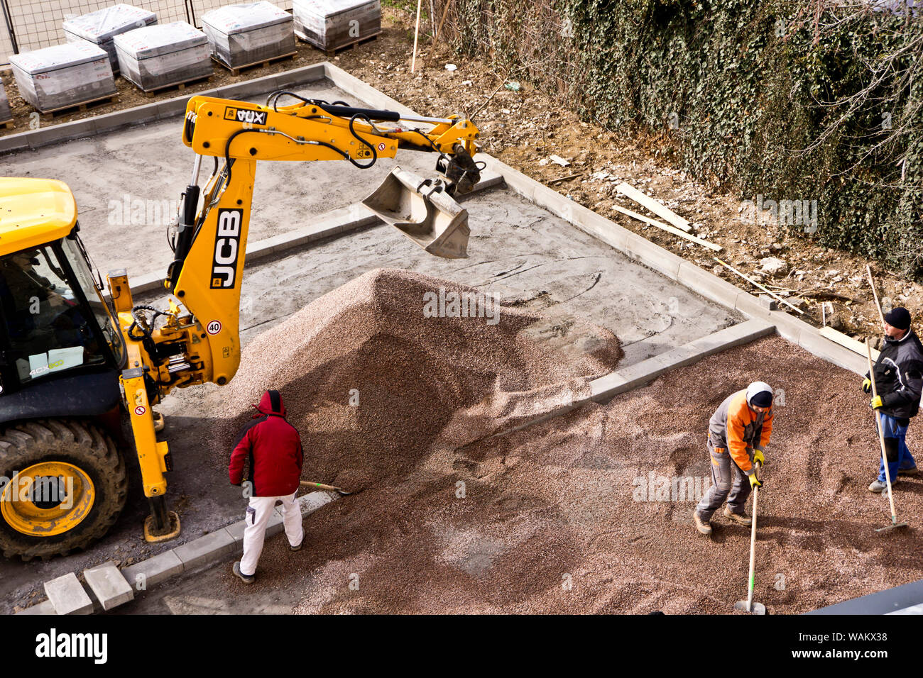 excavator and workers at work Stock Photo - Alamy