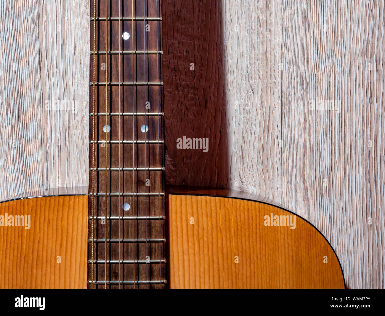 Classical acoustic guitar brown on light wooden background Stock Photo ...