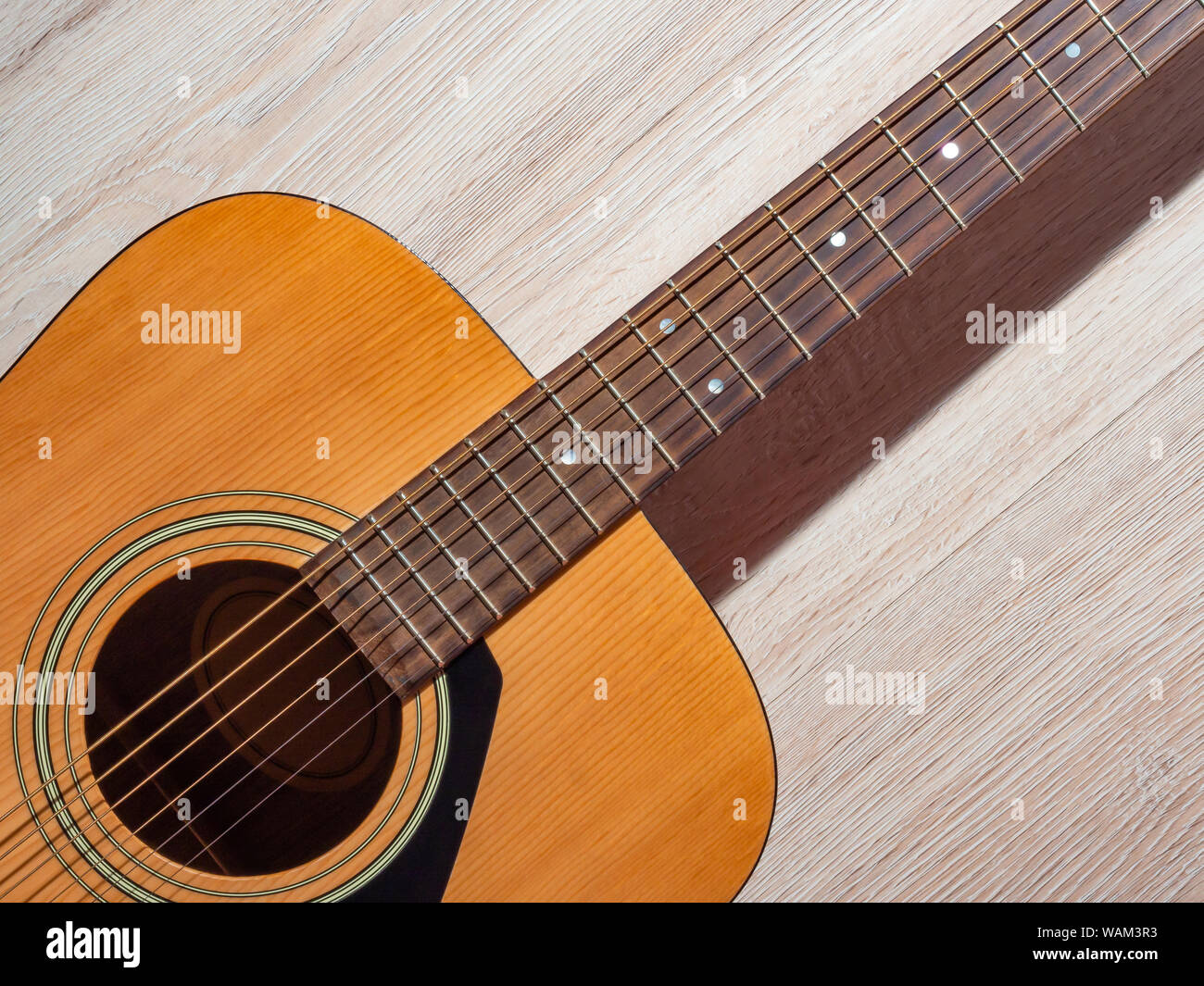 Classical acoustic guitar brown on light wooden background Stock Photo ...