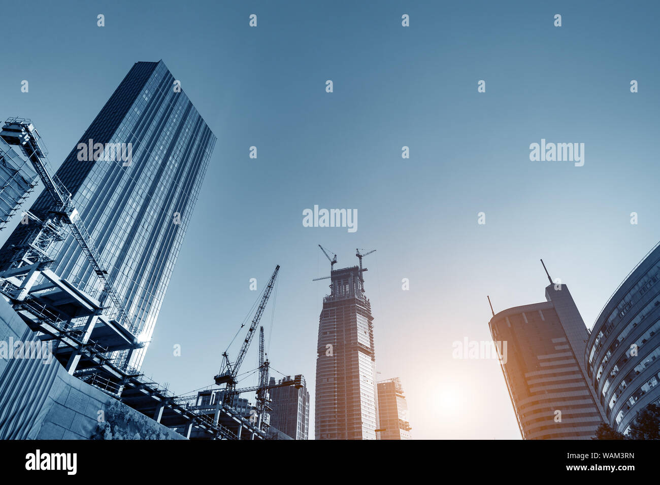 Building construction site, tall skyscrapers and cranes Stock Photo - Alamy
