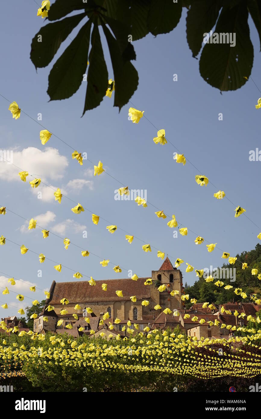 A view of a rural French village scene and surrounding hills and ...