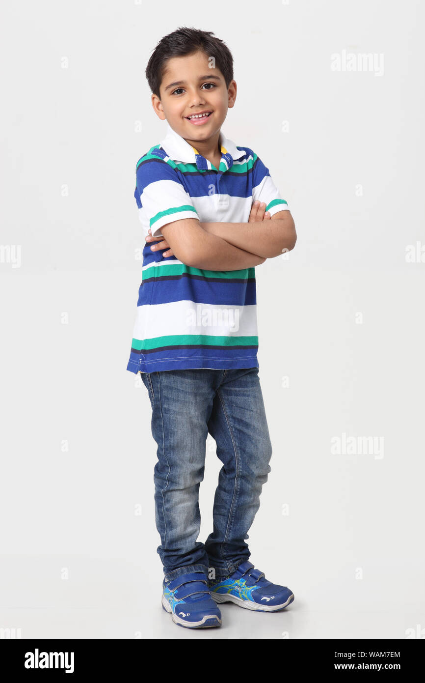 Boy standing with his arms crossed Stock Photo - Alamy