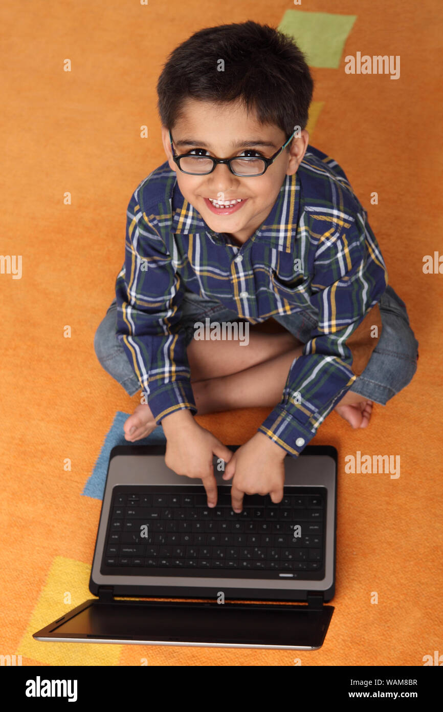 Boy using laptop india hi-res stock photography and images - Alamy