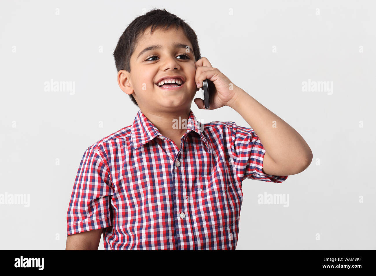 Boy mobile phone talking smiling hi-res stock photography and images ...