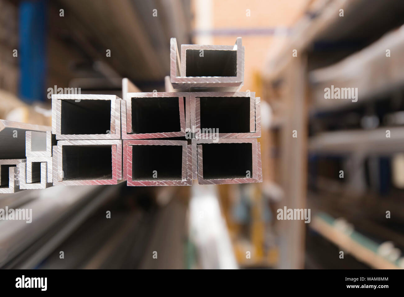 Milled lengths of aluminium (aluminum) alloy extrusion profiles sitting ...