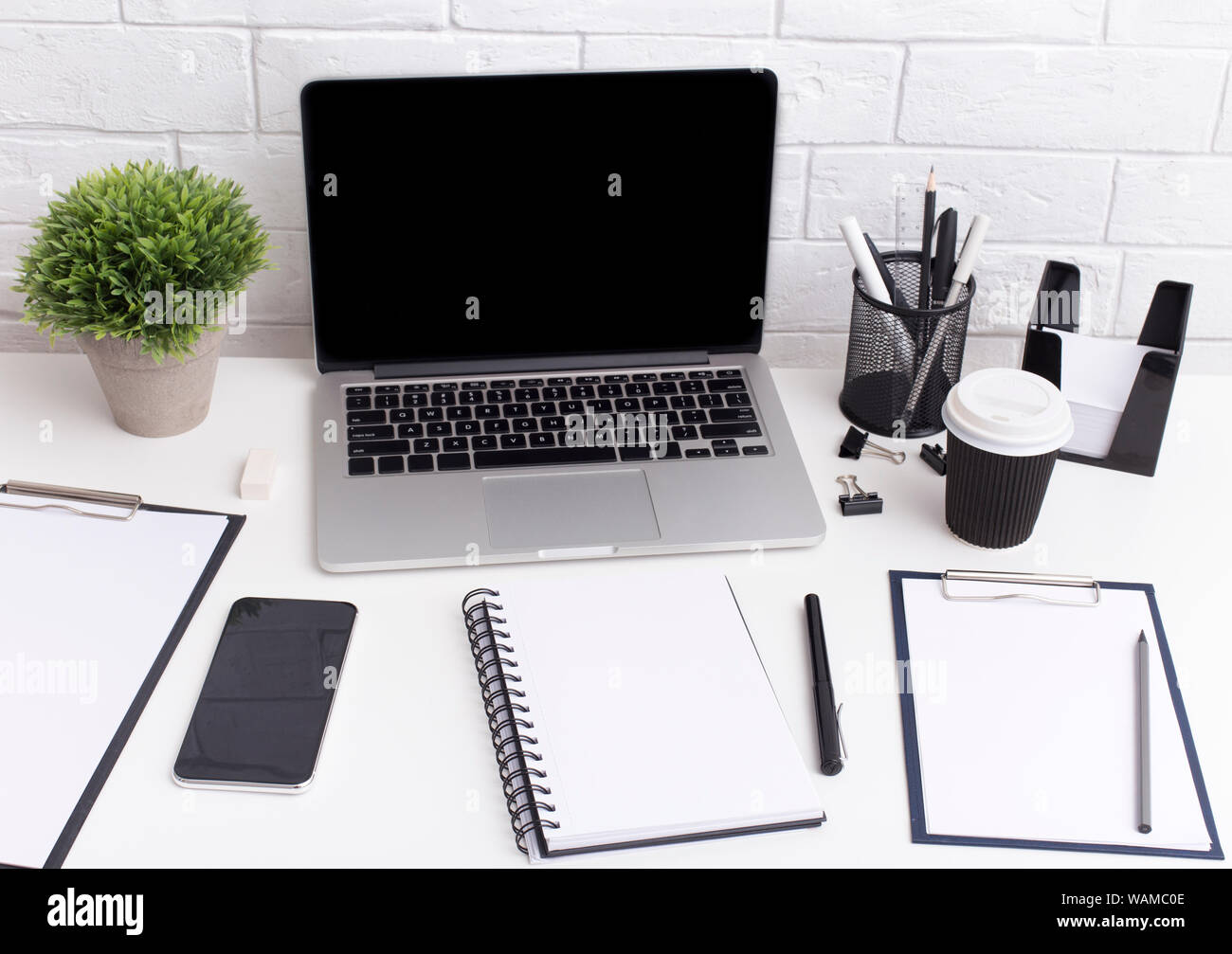 Modern workplace with laptop and notebook with copy space Stock Photo ...