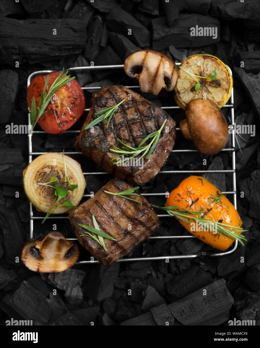 Grid with prepared meat steak and vegetables on grill Stock Photo - Alamy