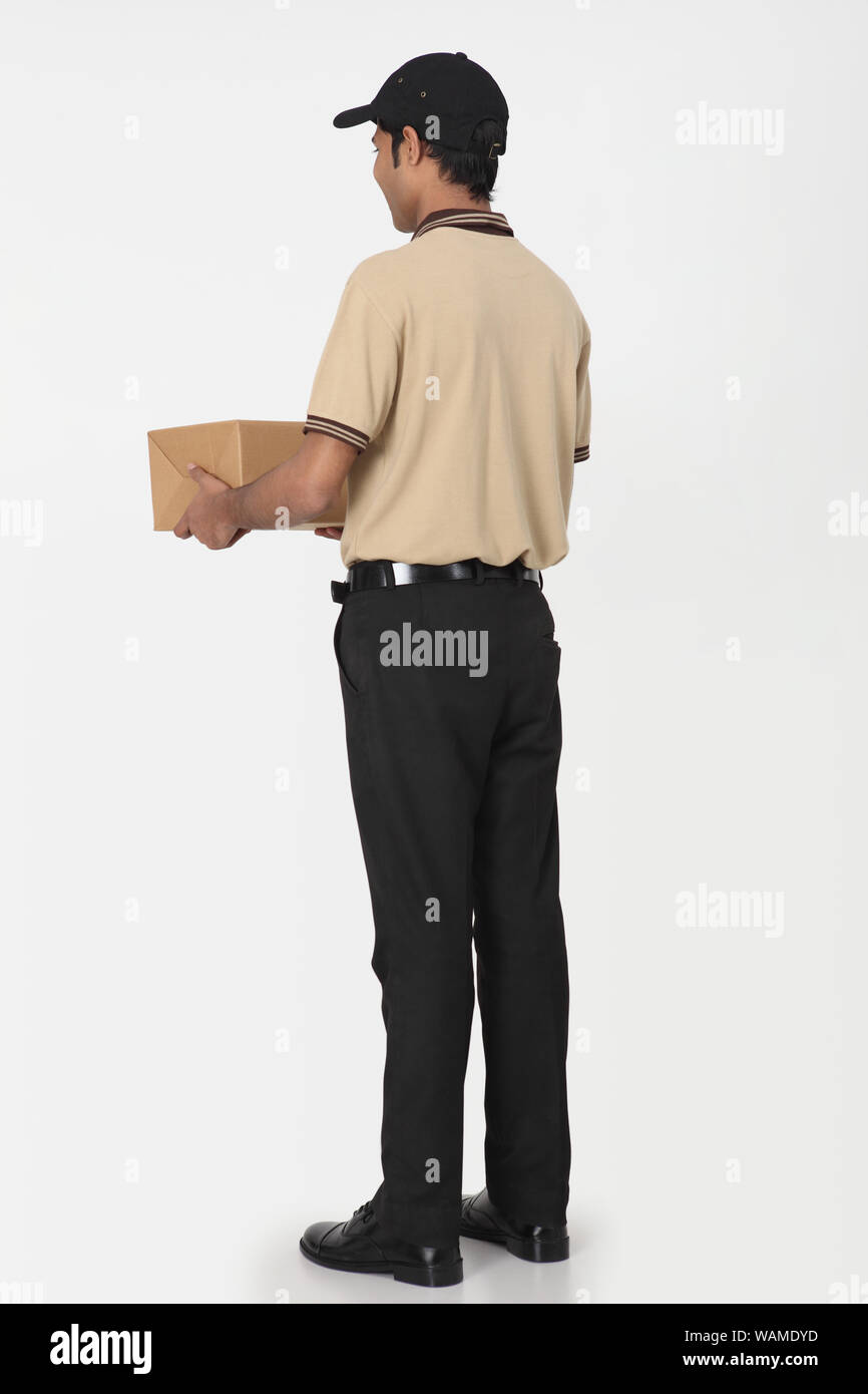 Delivery man rear view hi-res stock photography and images - Alamy