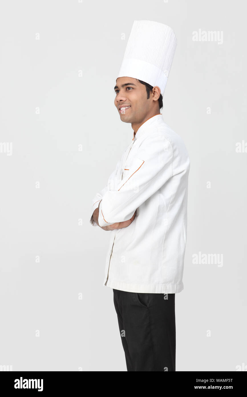 Chef standing with his arms crossed Stock Photo - Alamy