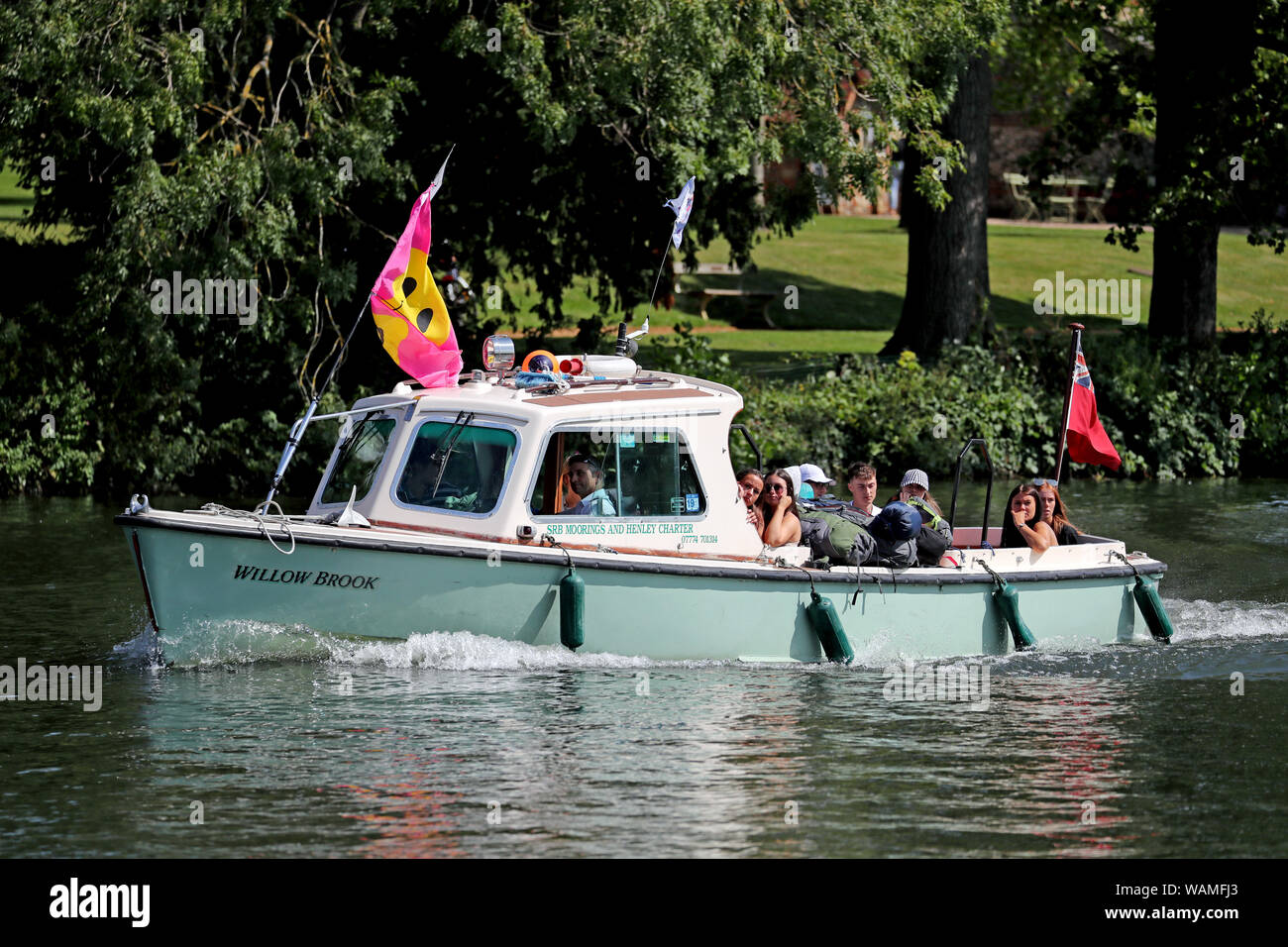 Festival goers arriving by boat for the Reading Festival at Richfield ...