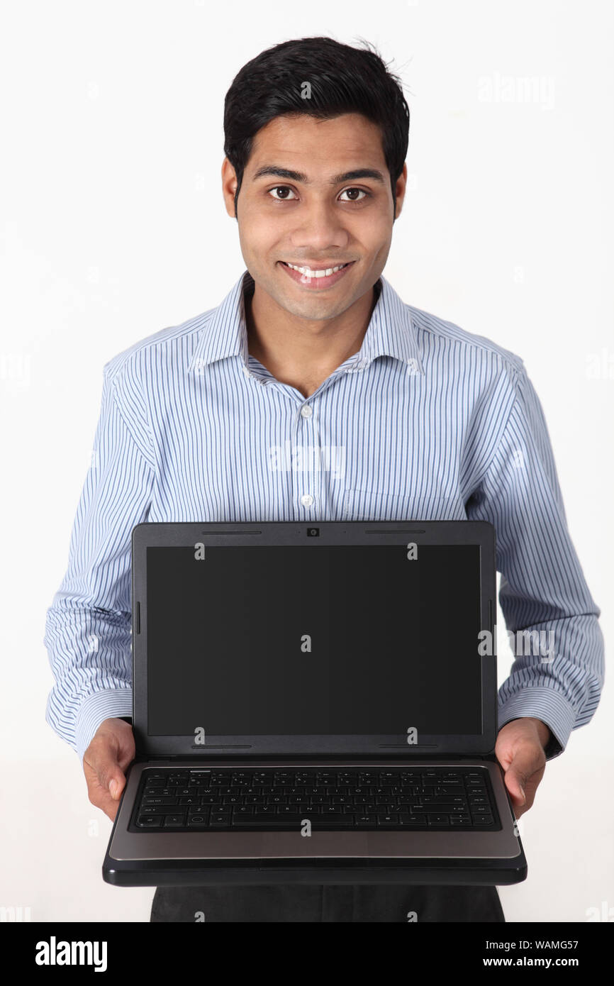 Salesman showing a laptop Stock Photo - Alamy