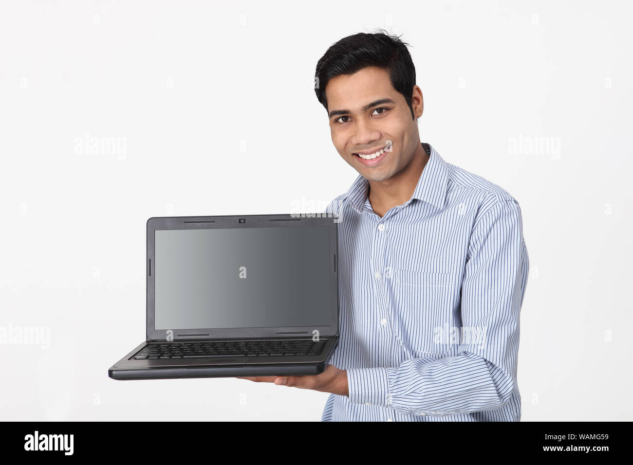 Salesman showing a laptop Stock Photo - Alamy