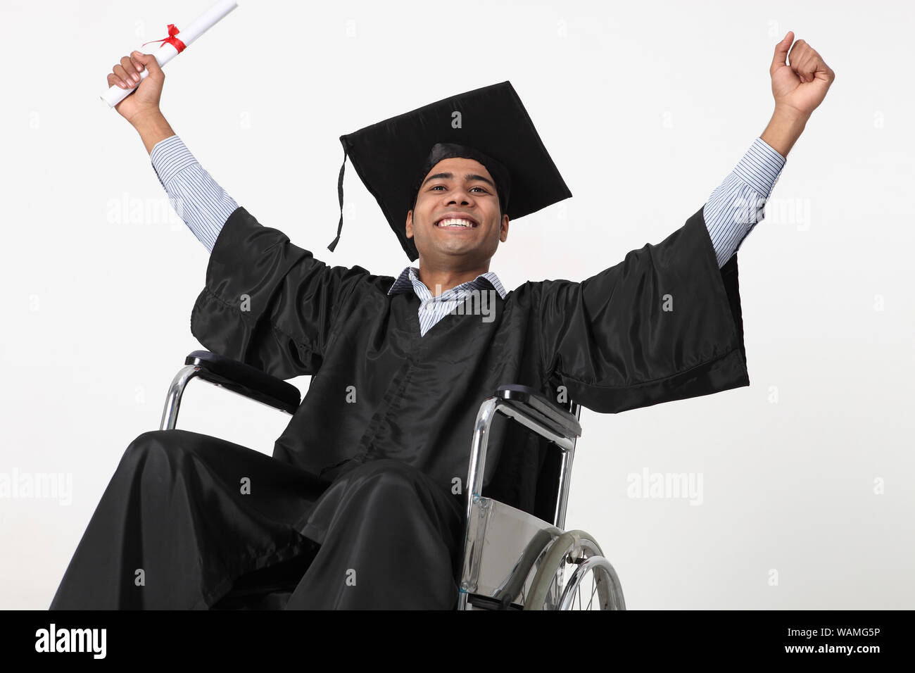 Handicapped university student celebrating with graduation degree Stock ...
