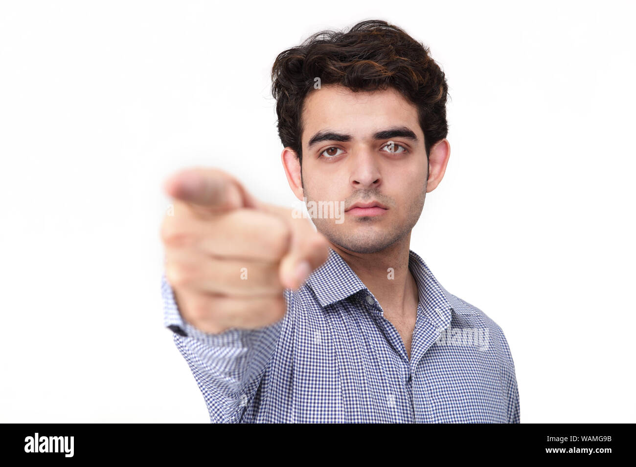 Young man pointing finger Stock Photo - Alamy