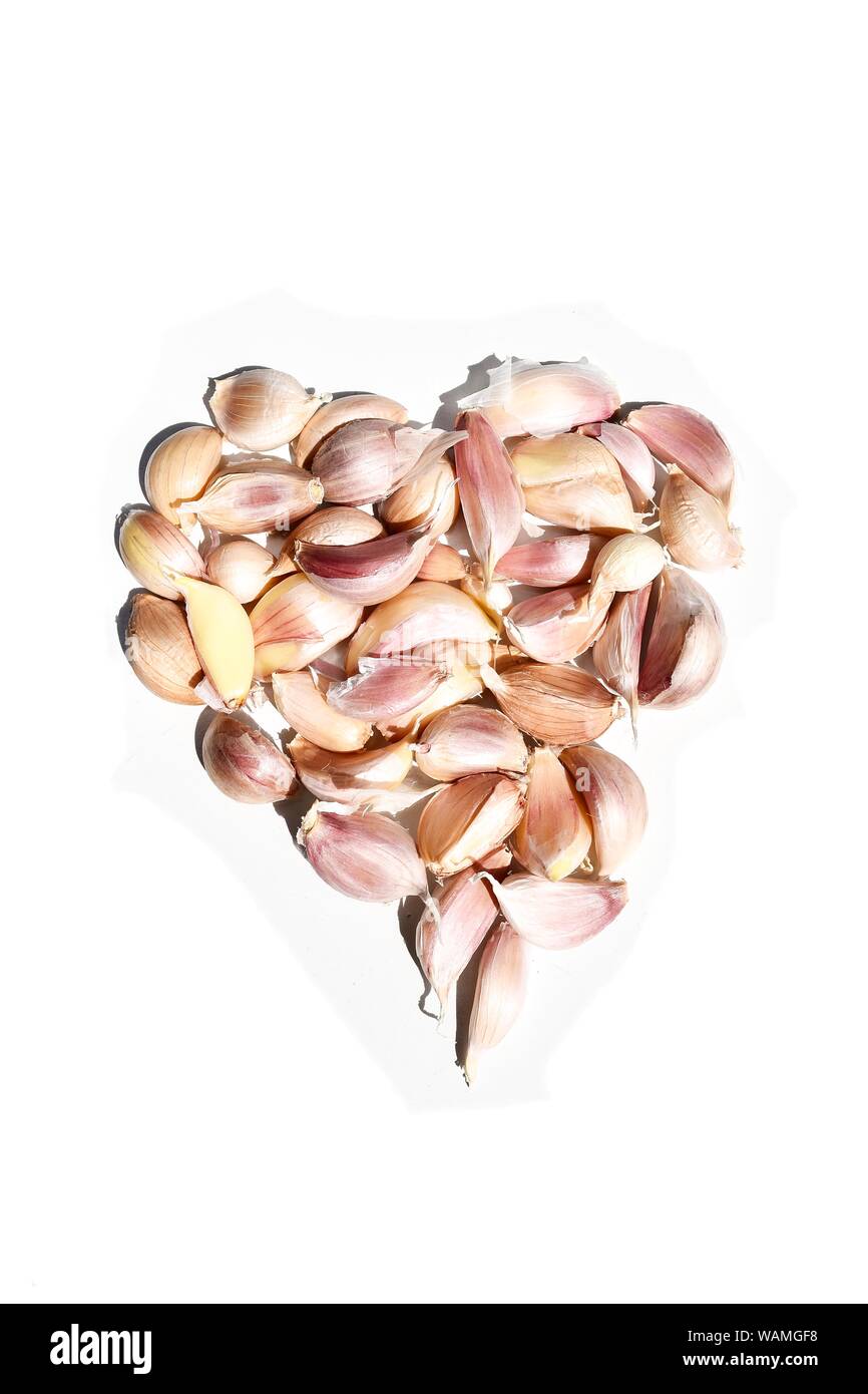 Group of Garlic cloves are arranged as a heart-shaped,Spices and herbs ...