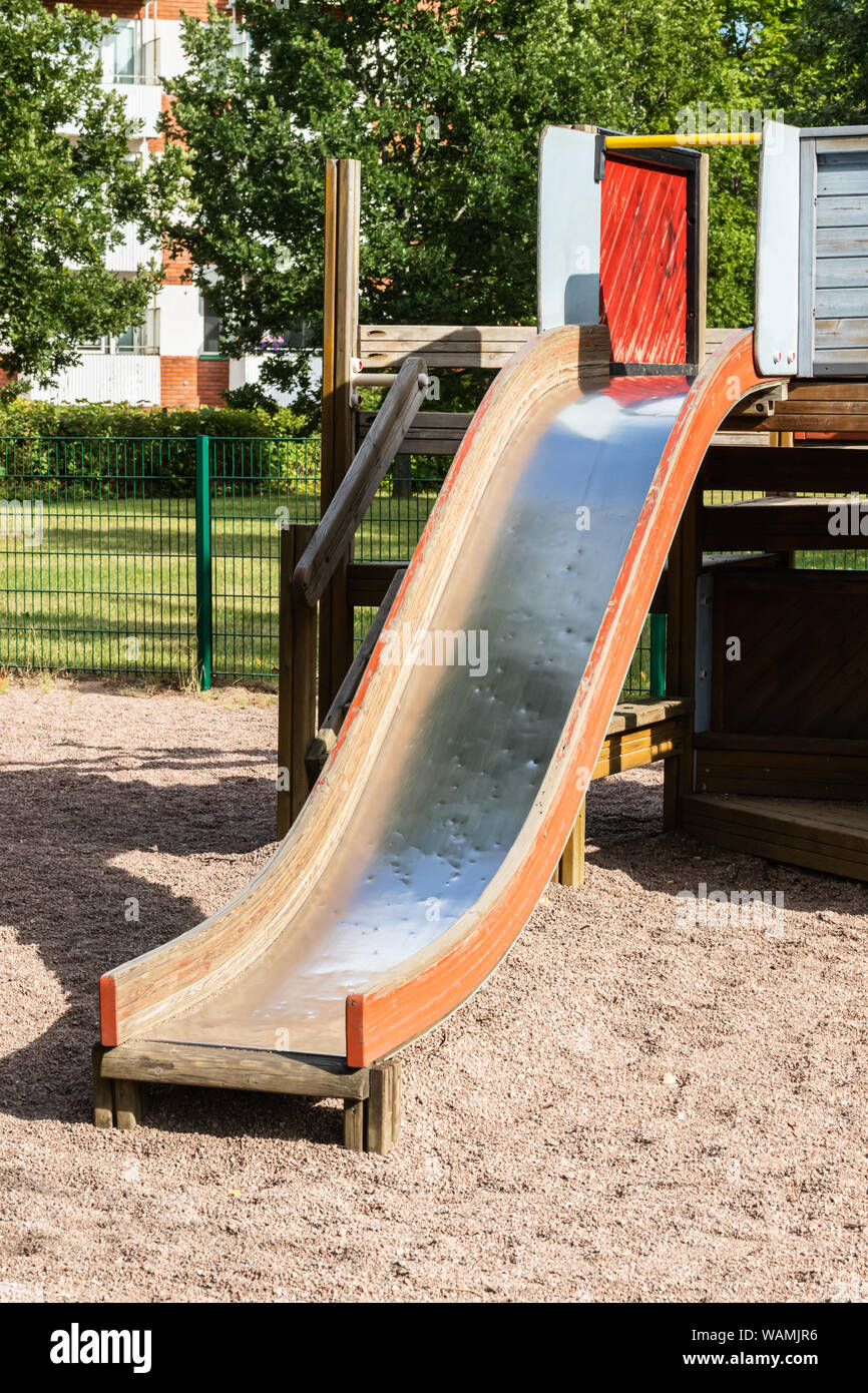 Playground slide on the sand at summer Stock Photo - Alamy