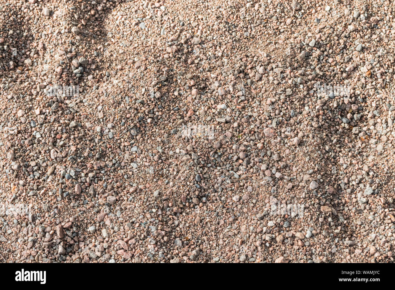 Small stones and sand of the playground Stock Photo - Alamy