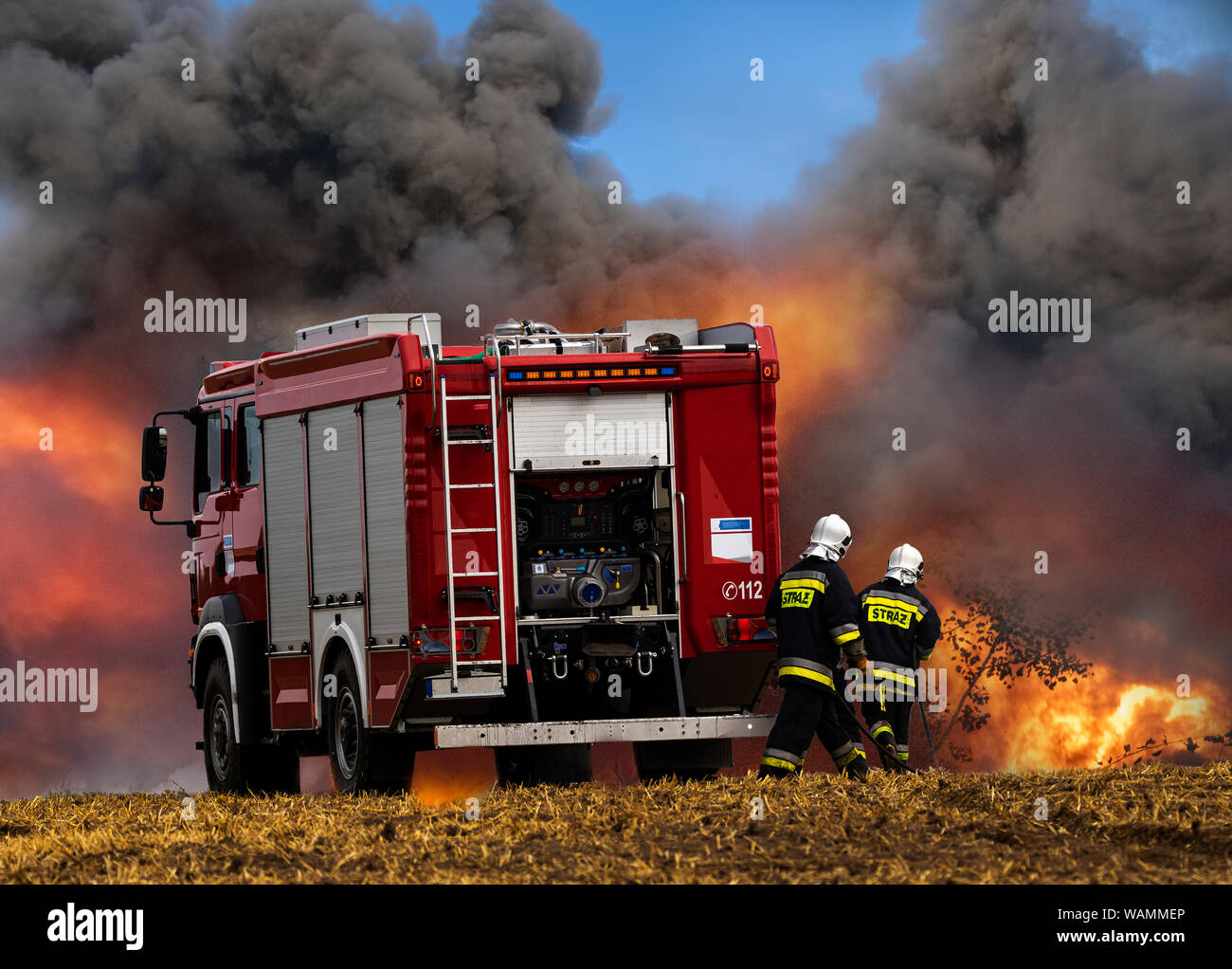 fire truck and firefighters during the fire extinguishing action Stock ...