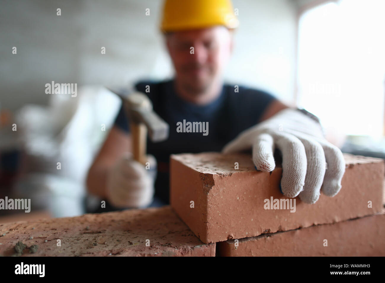 Professional bricklayer working on construction Stock Photo - Alamy