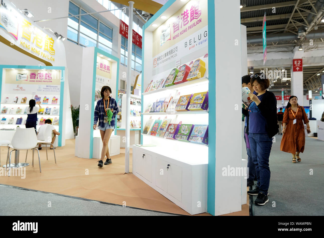 Beijing, China. 21st Aug, 2019. People read books at Hong Kong Pavilion ...