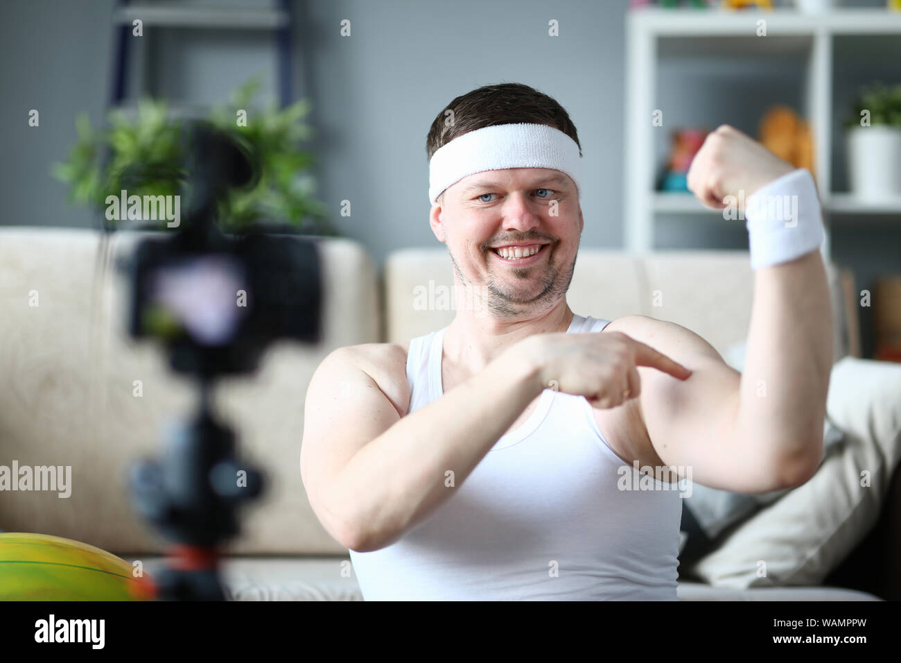 Bearded male showing biceps hi-res stock photography and images - Alamy