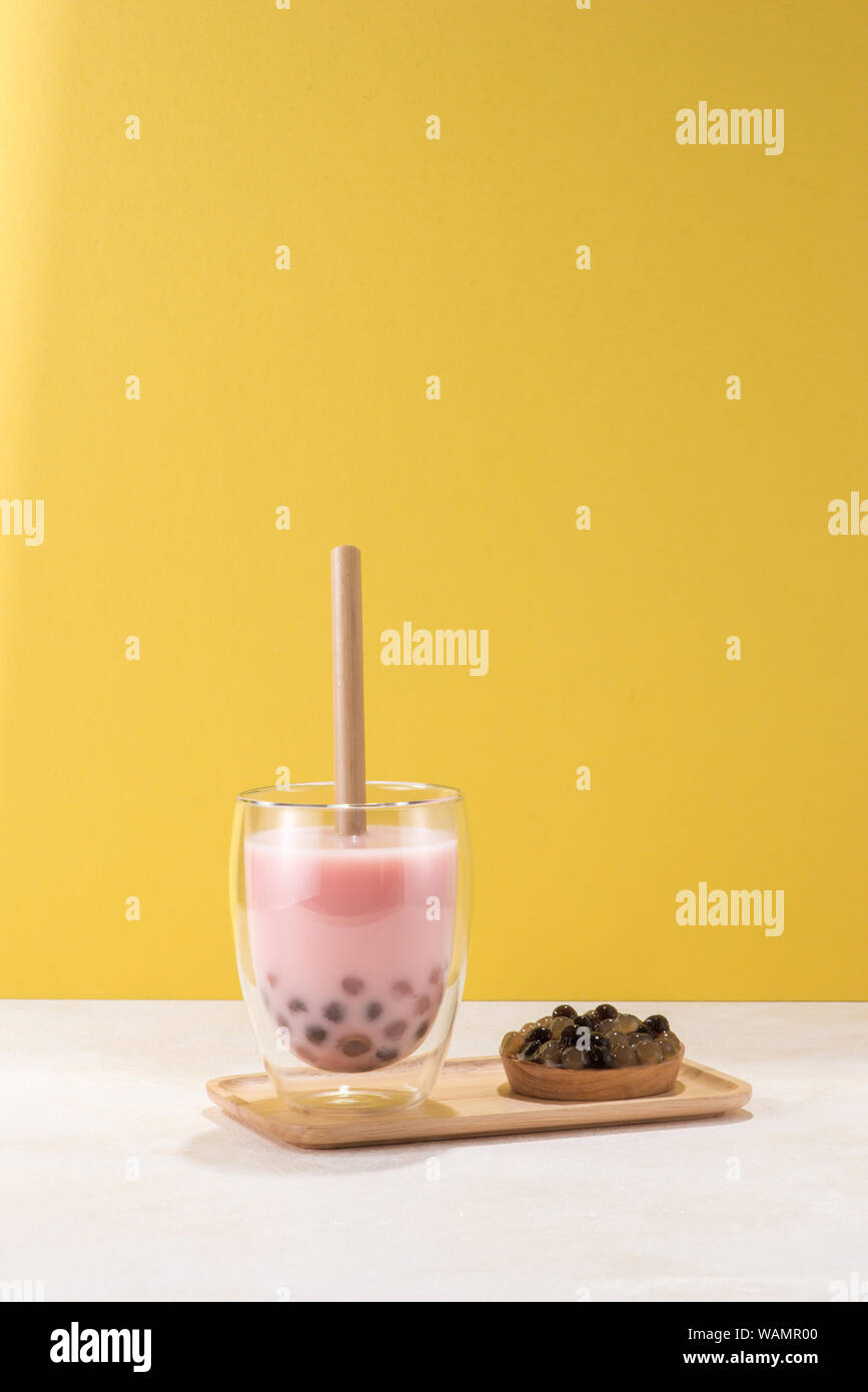 Strawberry flavor boba tea / buble tea with a plate of tapioca ball on ...
