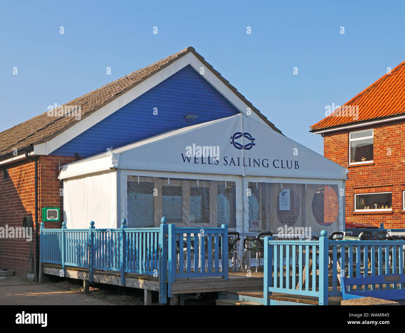A view of the Wells Sailing Club house at the east end of the harbour ...
