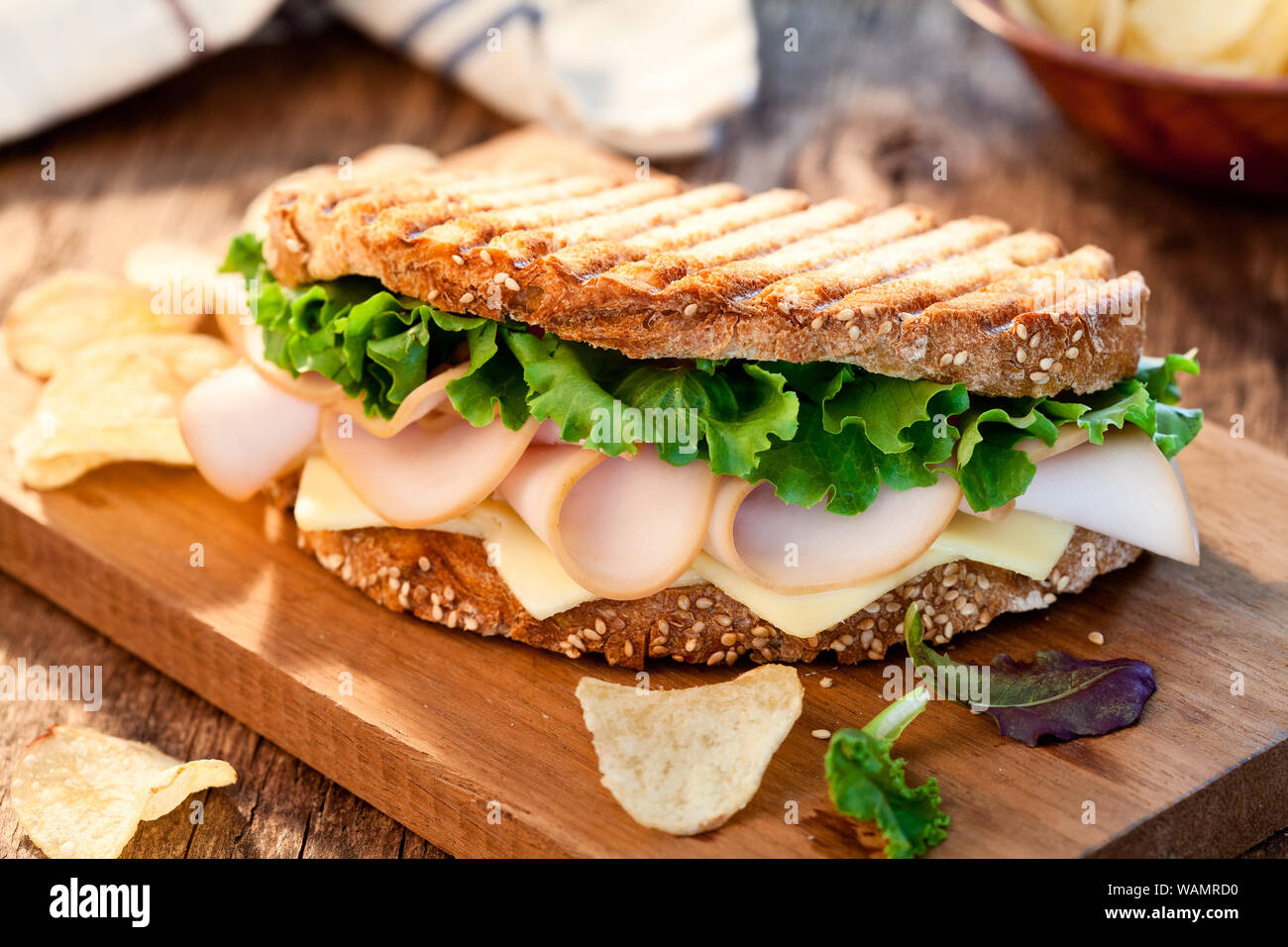 Homemade Toasted Ham And Cheese Sandwich With Chips Stock Photo - Alamy