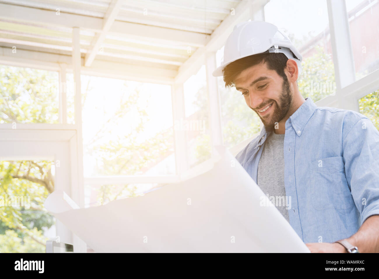 Engineer man(caucasian or european) with a beard, wearing a white ...
