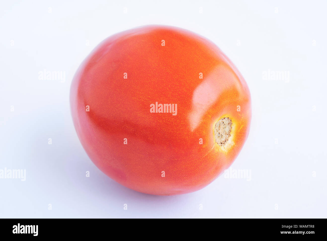 One green tomato above one red tomato hi-res stock photography and ...