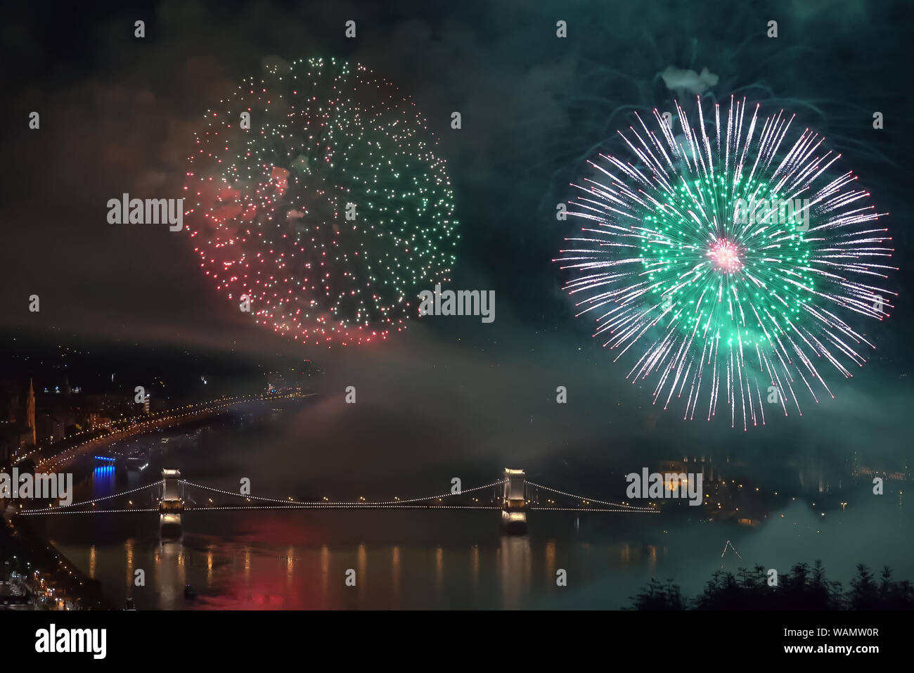 Budapest. 20th Aug, 2019. Fireworks are seen over the Danube river to ...