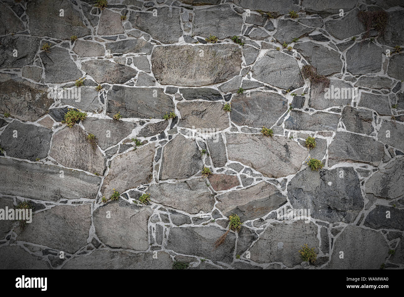 An abstract background image of an aged boulder wall Stock Photo - Alamy