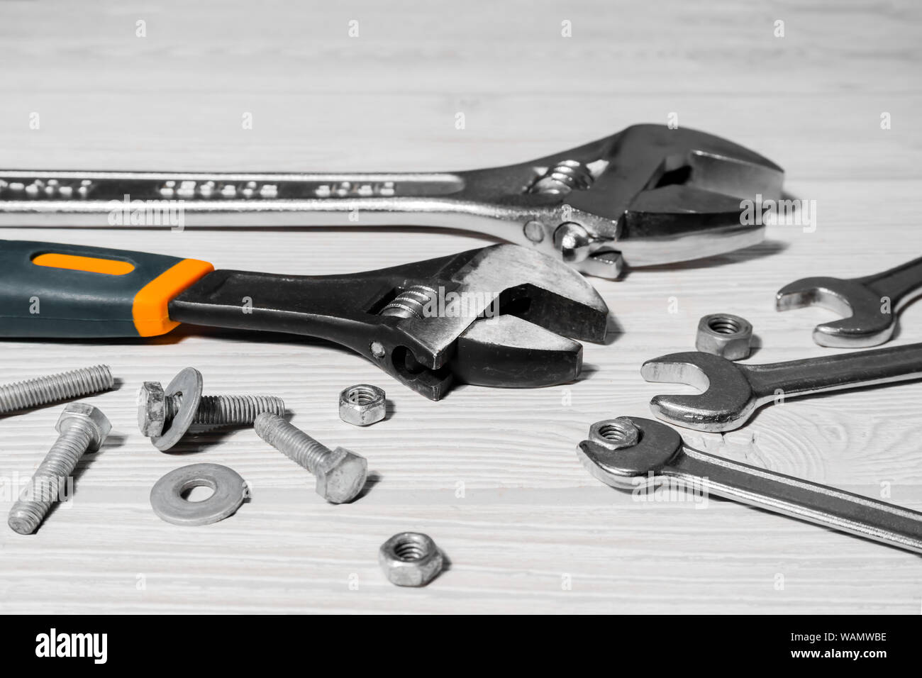 Adjustable spanners and ordinary wrenches, nuts and bolts are on the ...