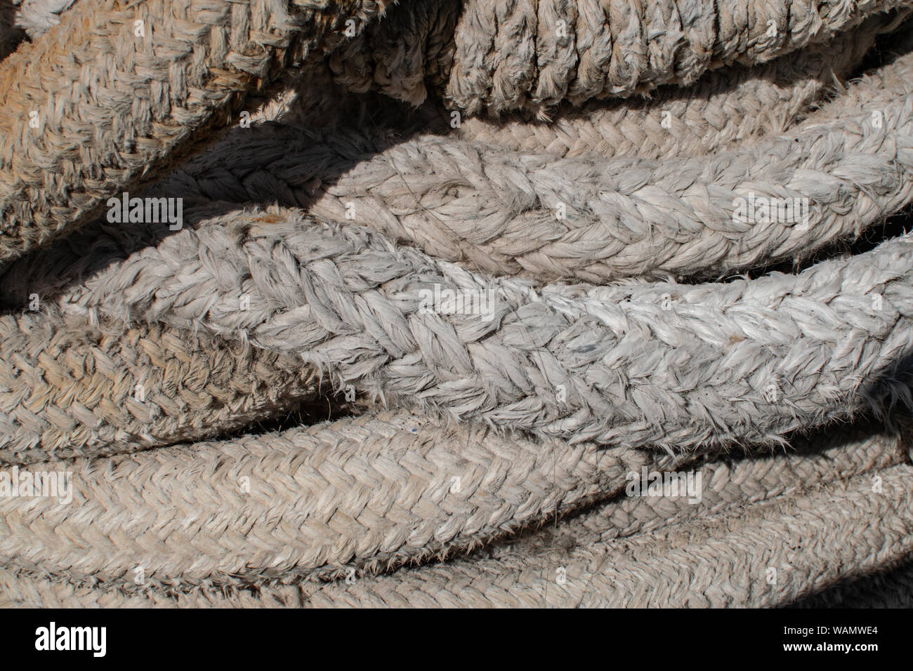 White aged rolled rope, close view, with sunlight Stock Photo - Alamy
