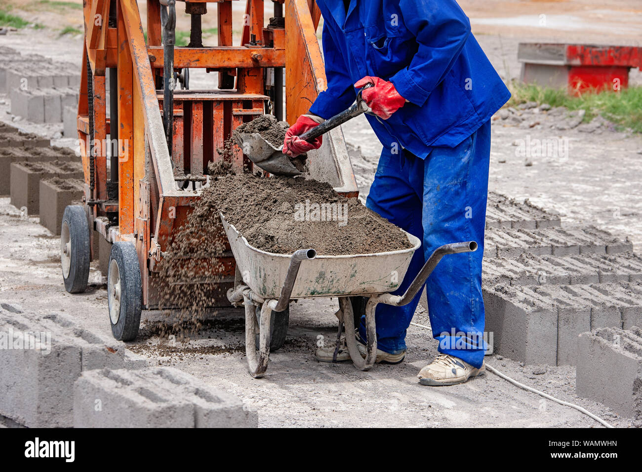 Construction Worker Pushing Wheelbarrow High Resolution Stock ...