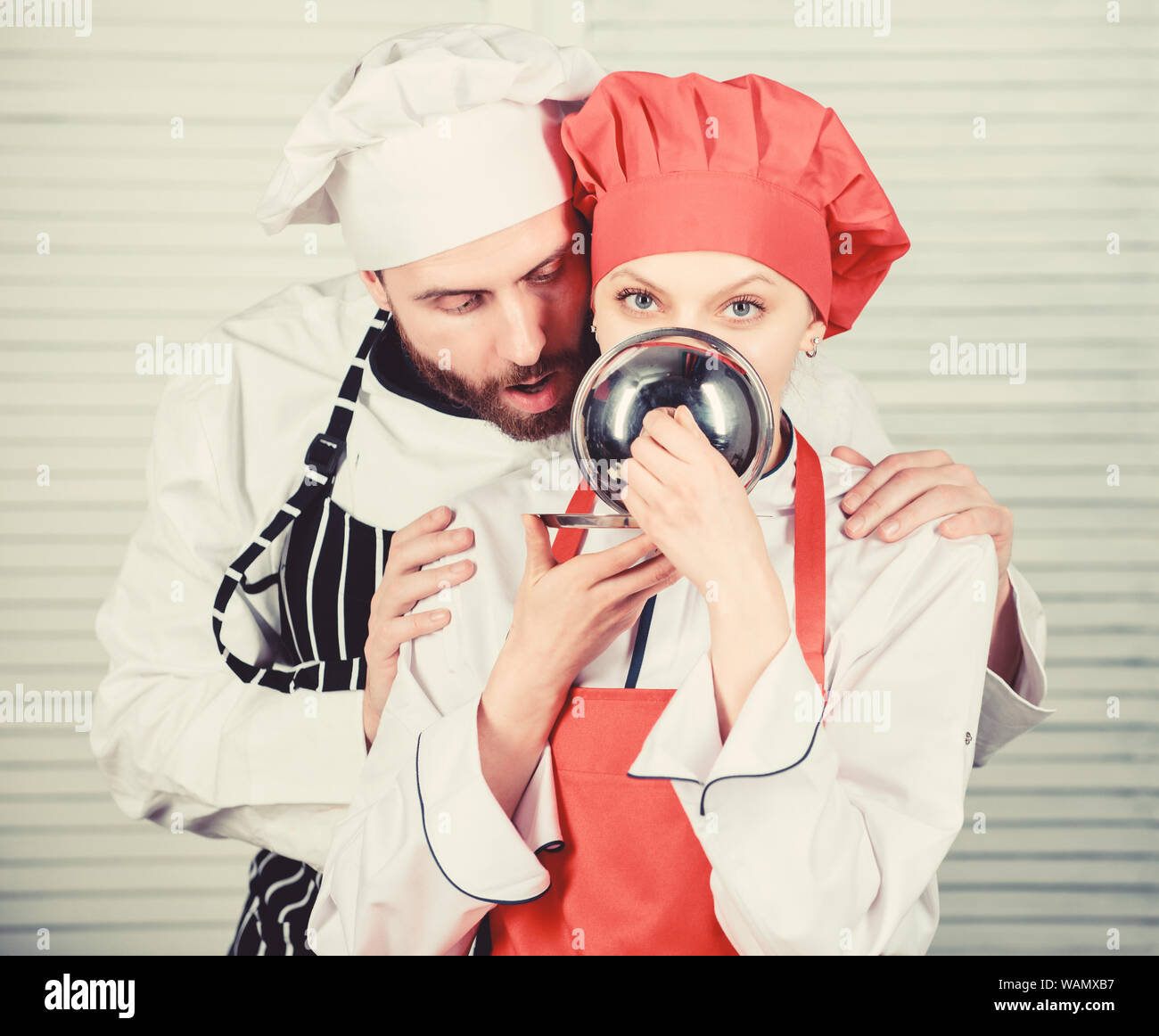 chefs compliment. man and woman chef in restaurant. couple in love with ...