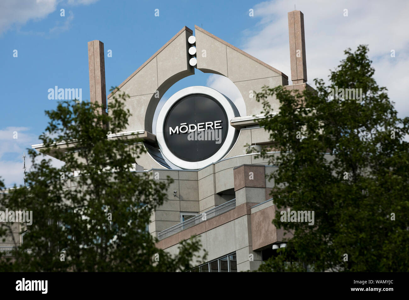 A logo sign outside of the headquarters of Modere in Springville, Utah ...