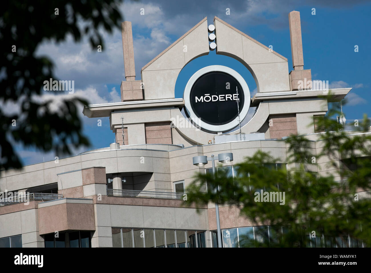A logo sign outside of the headquarters of Modere in Springville, Utah ...