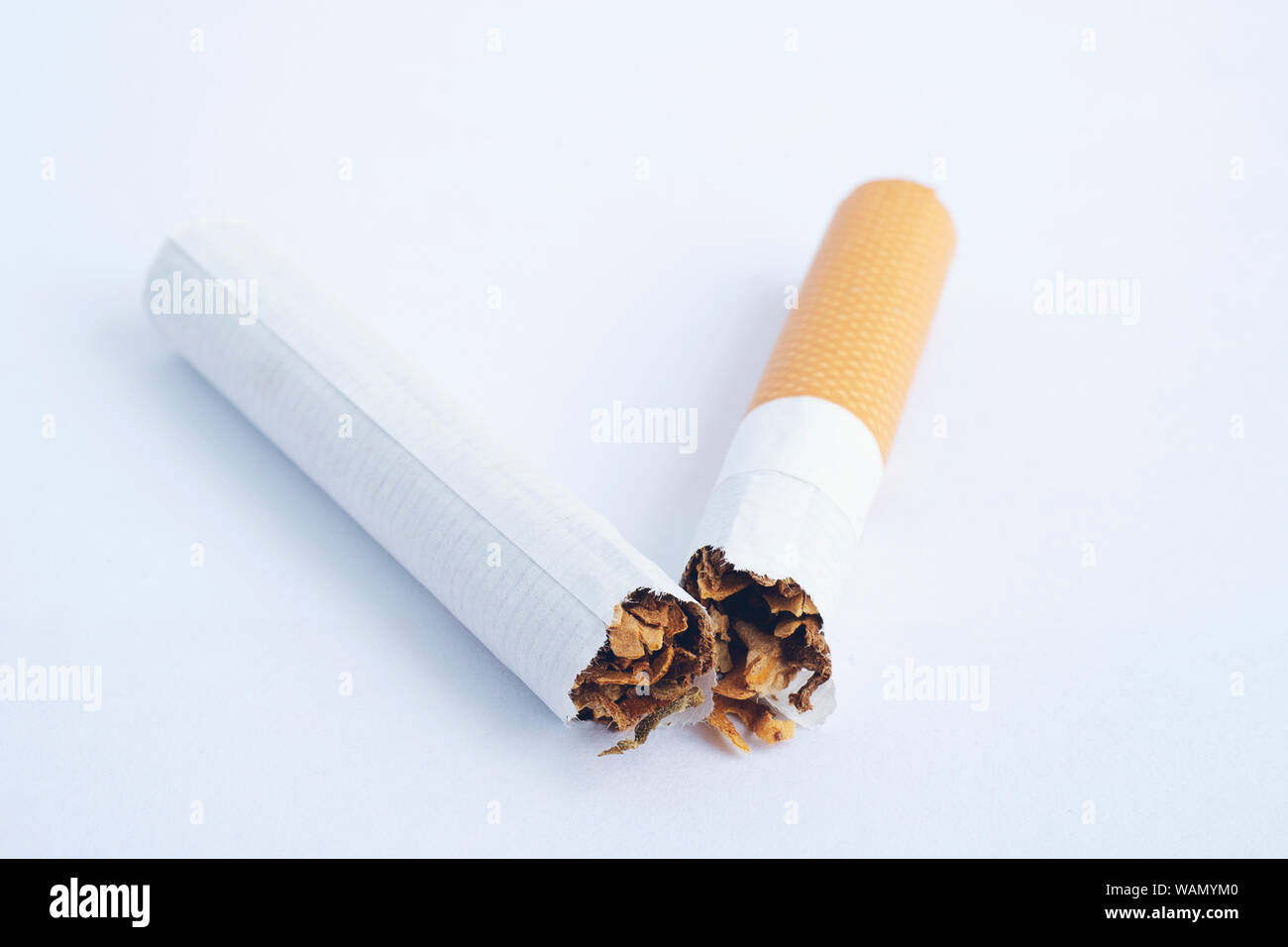 Broken cigarette isolated on white background Stock Photo - Alamy