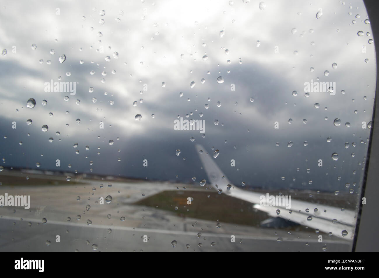 Cloudy sky and raindrops through the window Stock Photo - Alamy