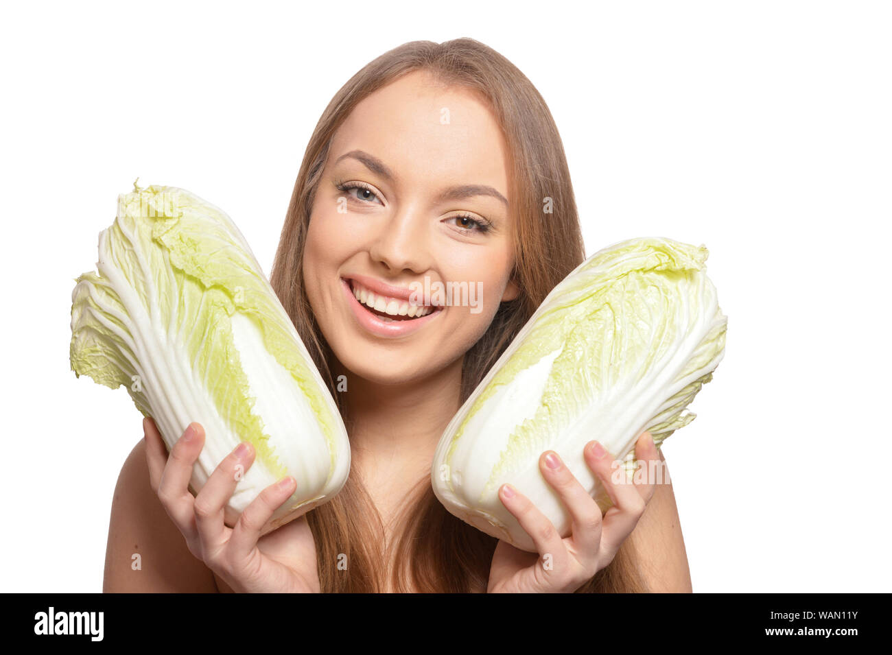 Portrait of beautiful young woman with cabbage isolated on white ...