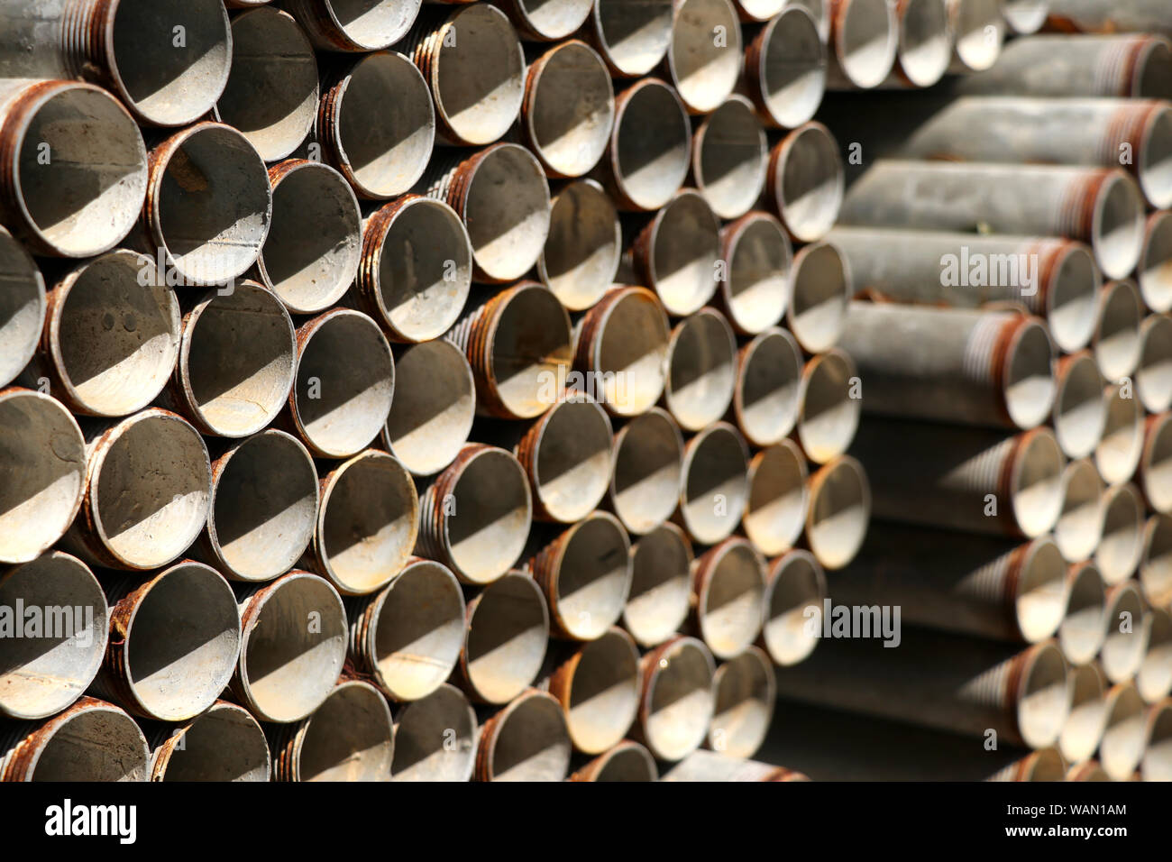 Stacked steel pipes stacked together Stock Photo - Alamy