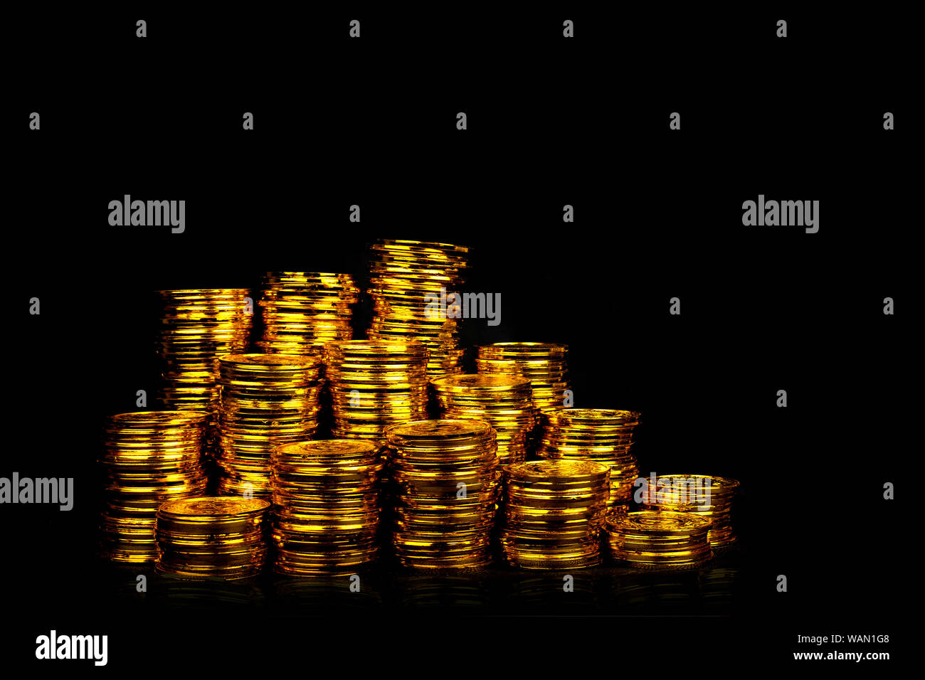Stacking gold coin in treasure stack at black background Stock Photo ...