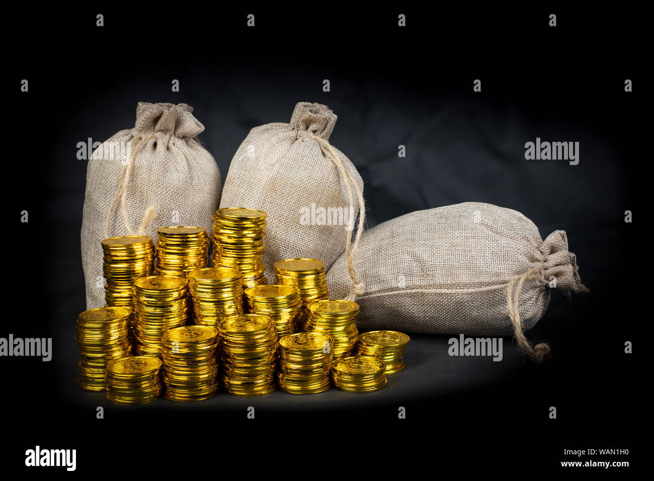 Stacking gold coin in treasure stack at black background Stock Photo ...
