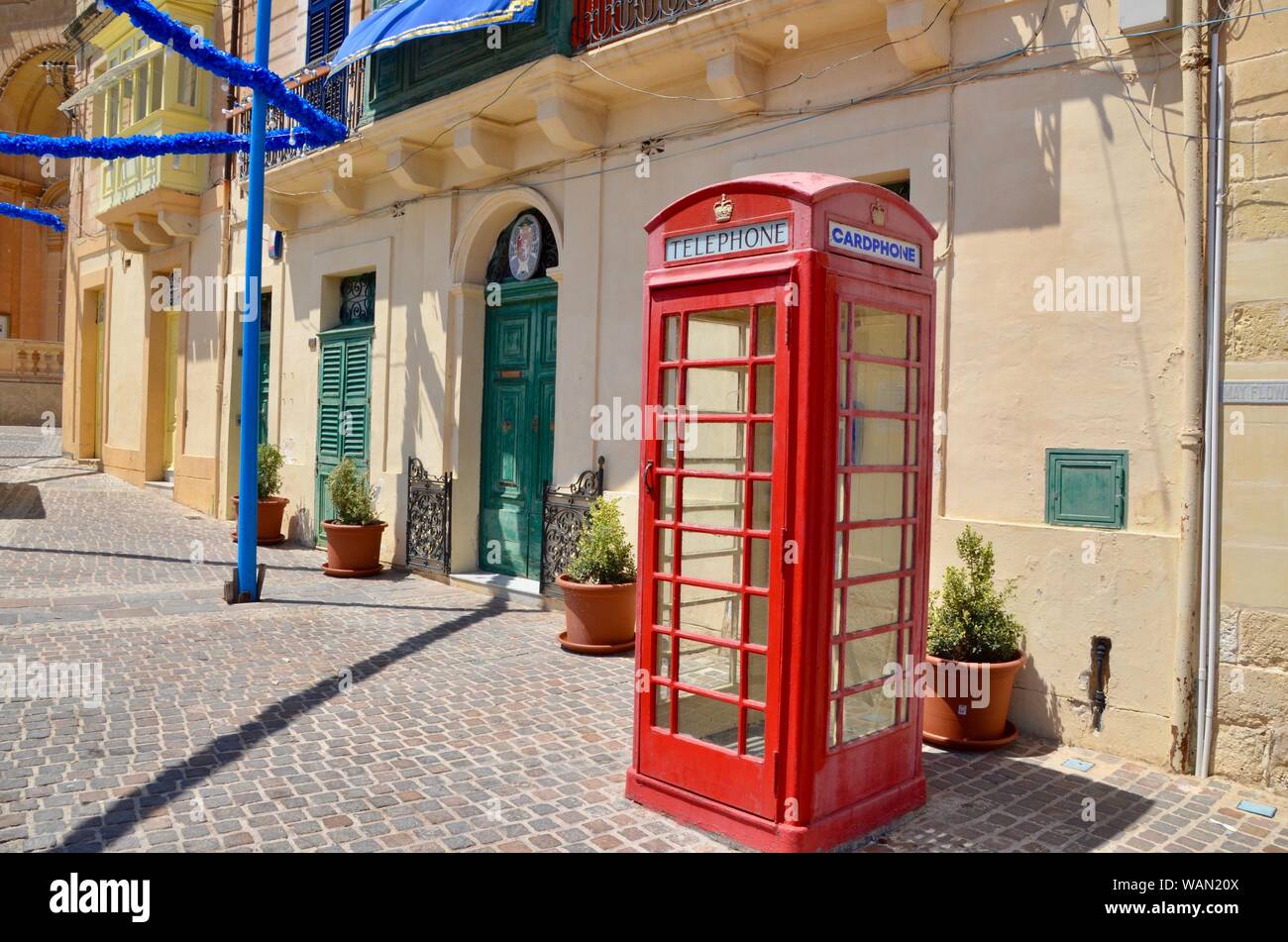 Marsaxlokk town malta red phone box kiosk british style Stock Photo - Alamy