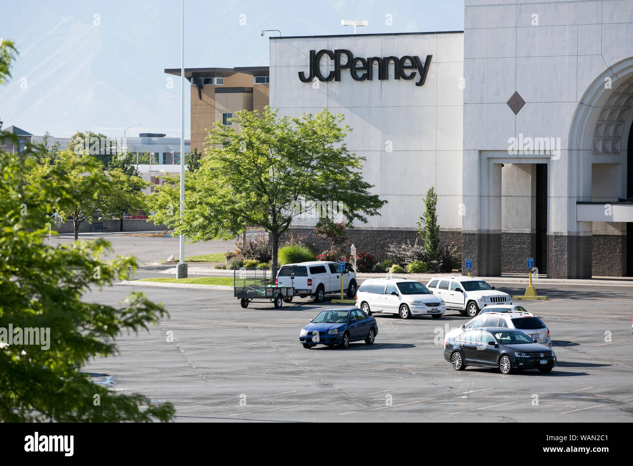 A logo sign outside of a JC Penney retail store location in Provo, Utah ...